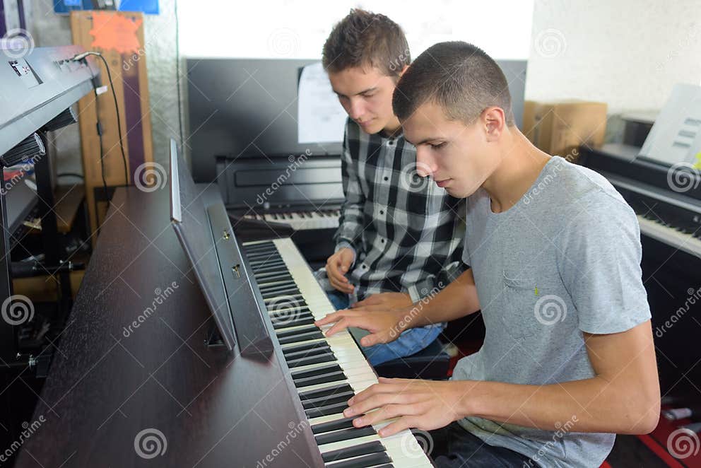 Young man playing keyboard stock image. Image of pianist - 172604677