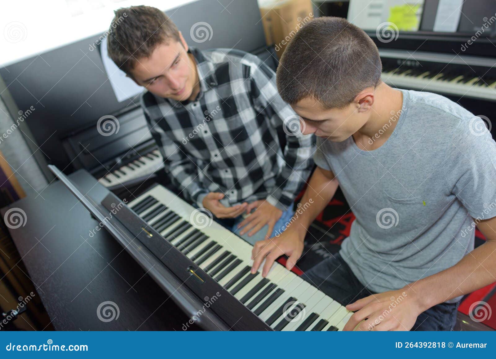 Young man playing keyboard stock photo. Image of black - 264392818