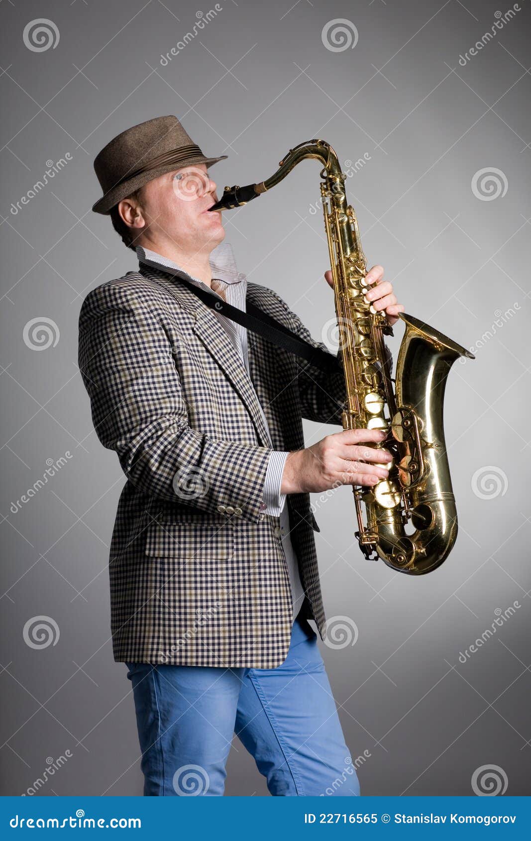 Young man playing the sax stock image. Image of background - 22716565