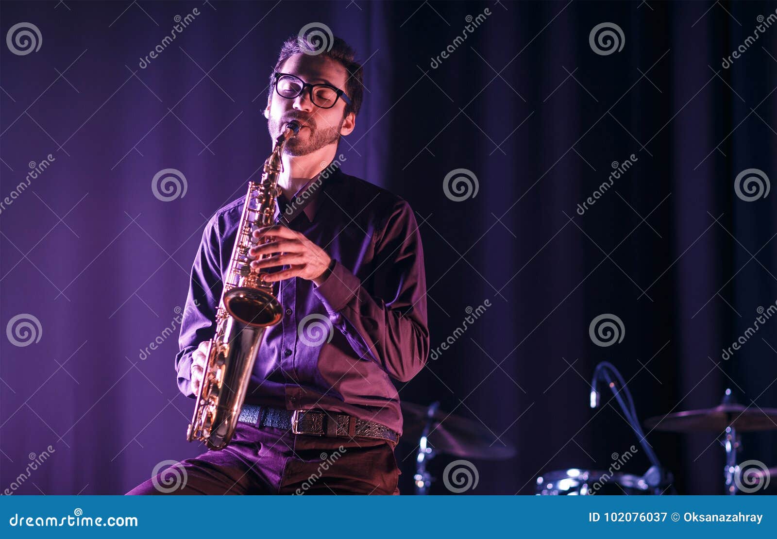 Young Man Playing on a Saxophone Stock Image - Image of person, color ...