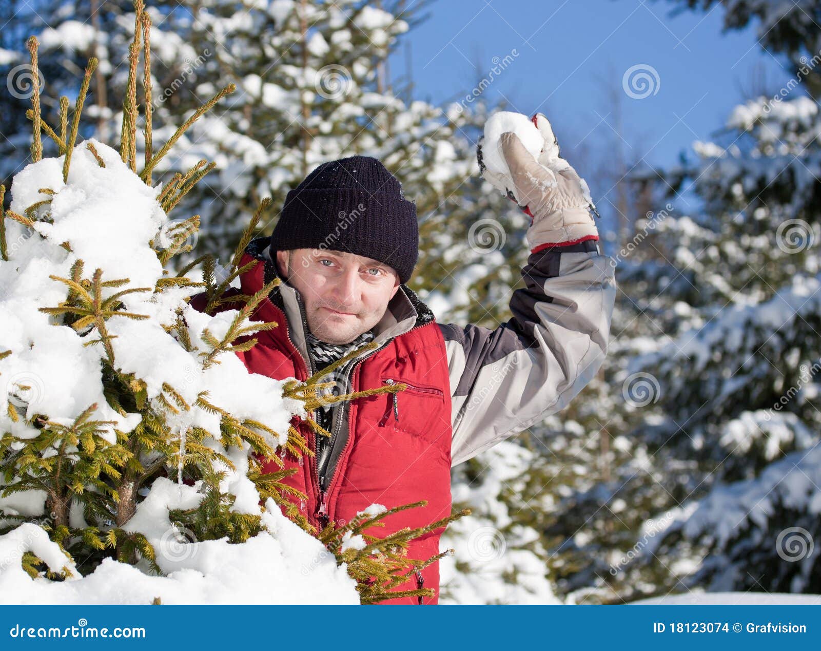 Young Man Playing with Snowball Stock Photo - Image of face, park: 18123074
