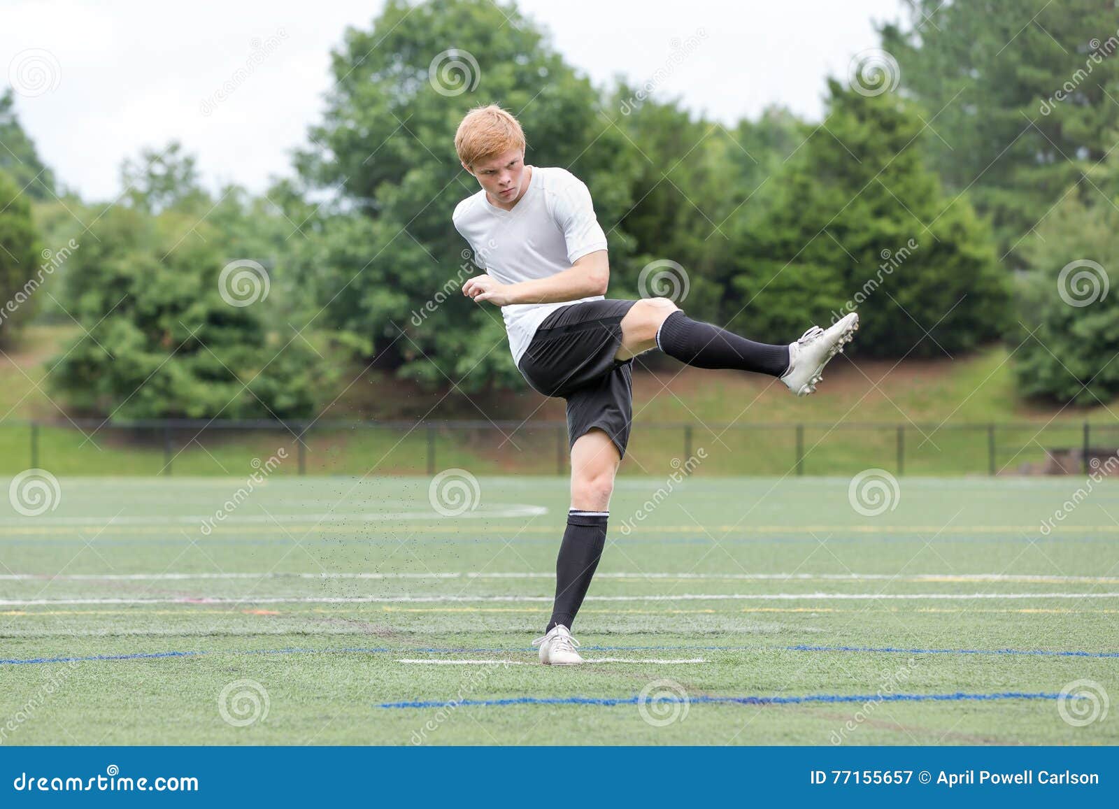 Young Man Playing Soccer - Kicking Ball Stock Image - Image of athletic ...