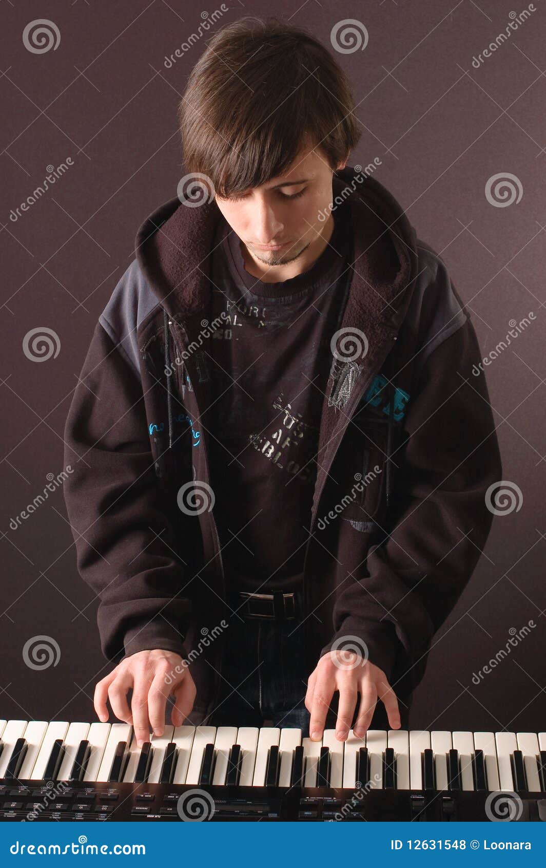 Young Man Playing on a Synthesizer Stock Photo - Image of audio ...