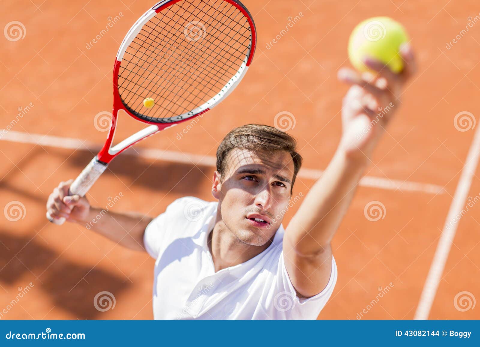 Young man playing tennis stock photo. Image of expression - 43082144