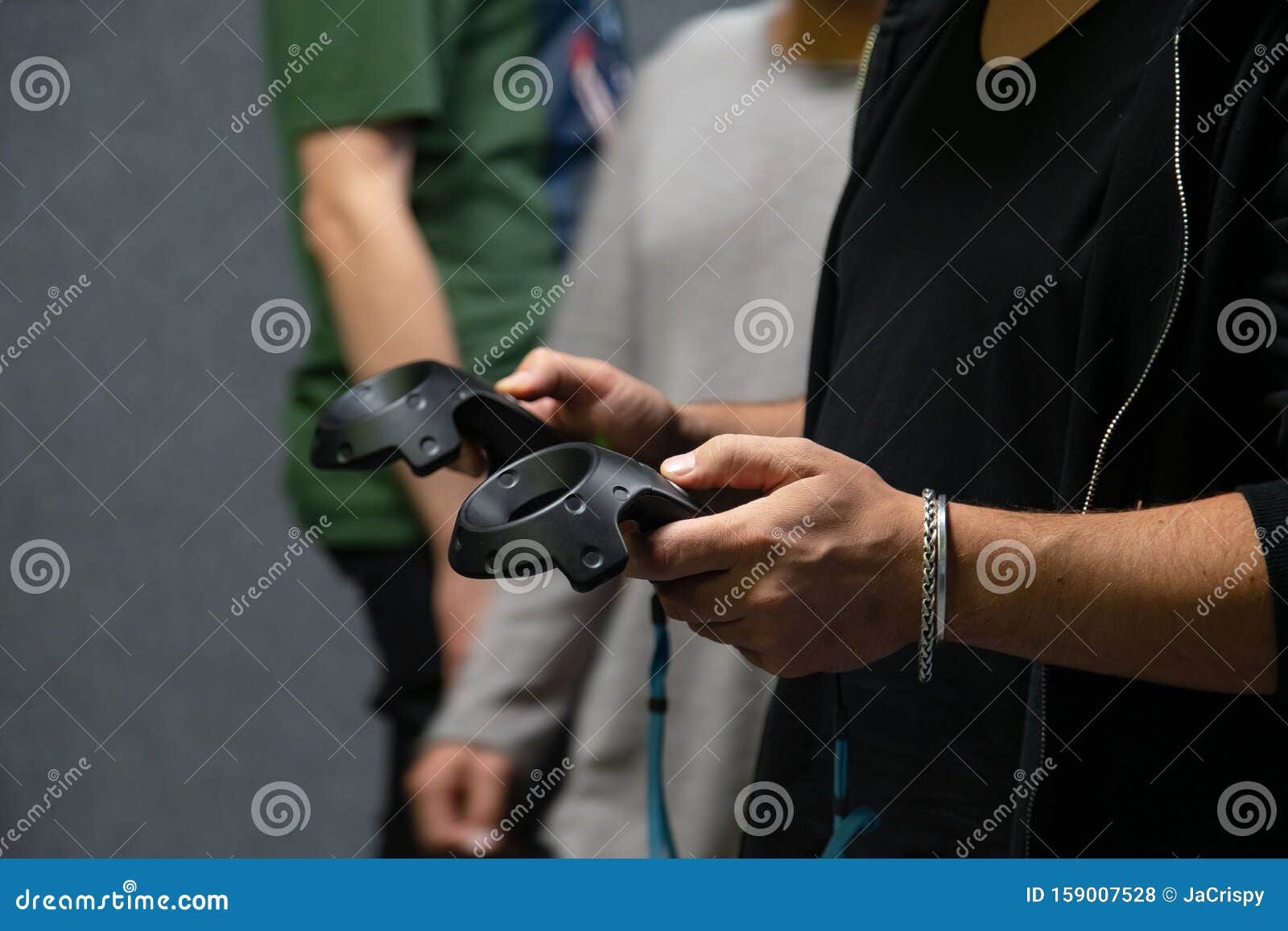 Young Man Playing Virtual Reality Game while Wearing Headset and ...