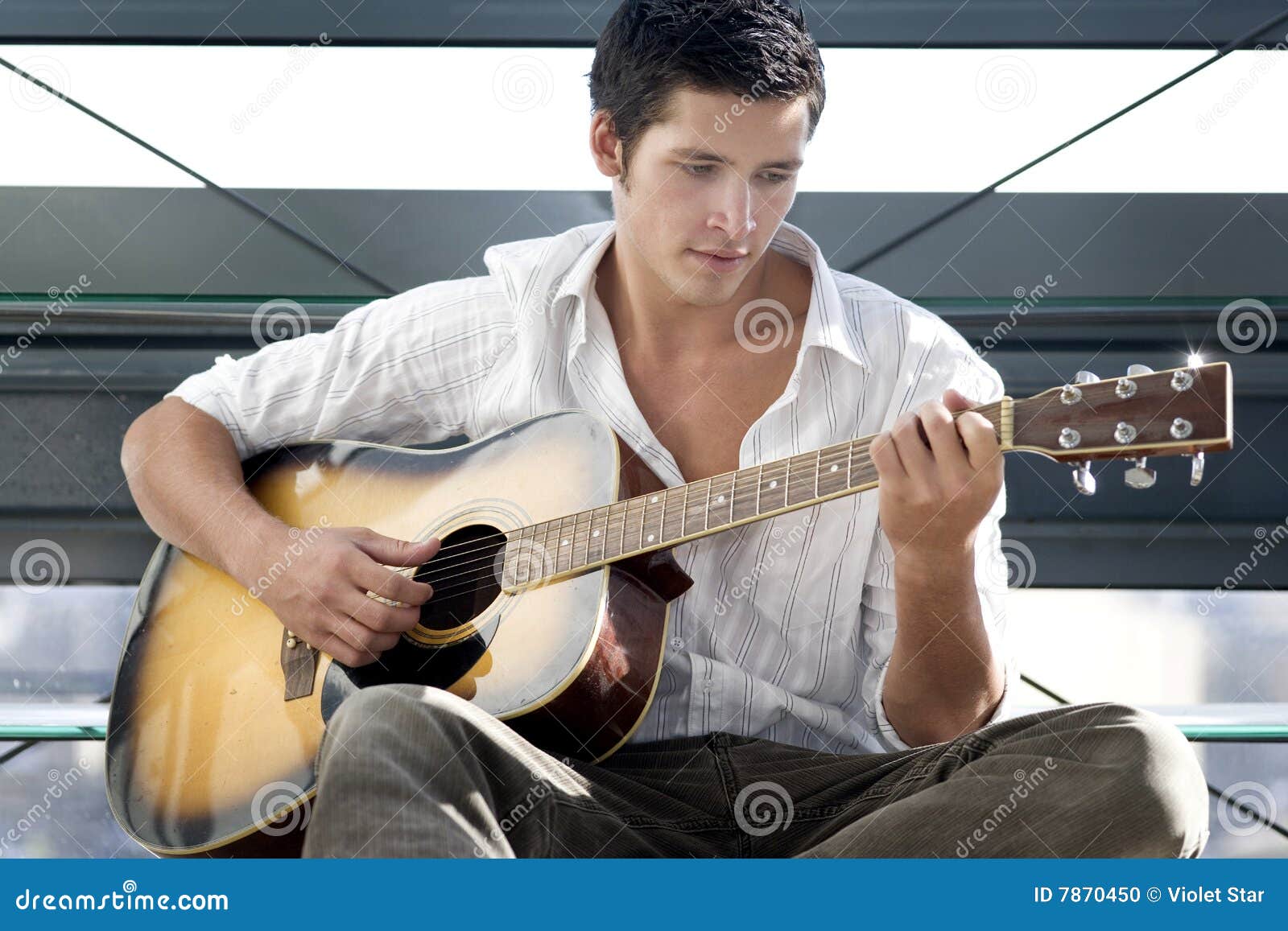 Young man plays guitar stock photo. Image of playing, sound - 7870450