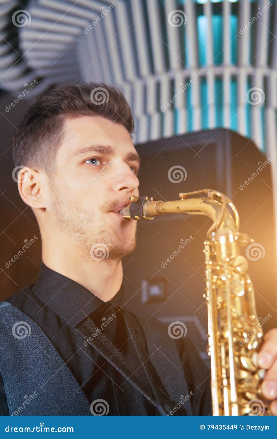 Young Man Plays a Musical Instrument Saxophone Stock Image - Image of ...
