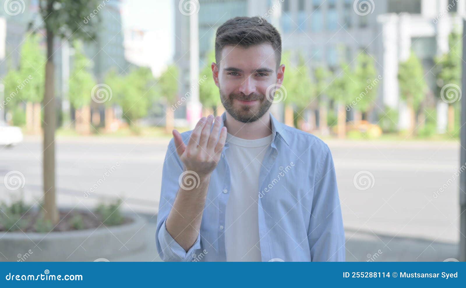 Young Man Pointing at the Camera and Inviting Outdoor Stock Photo ...