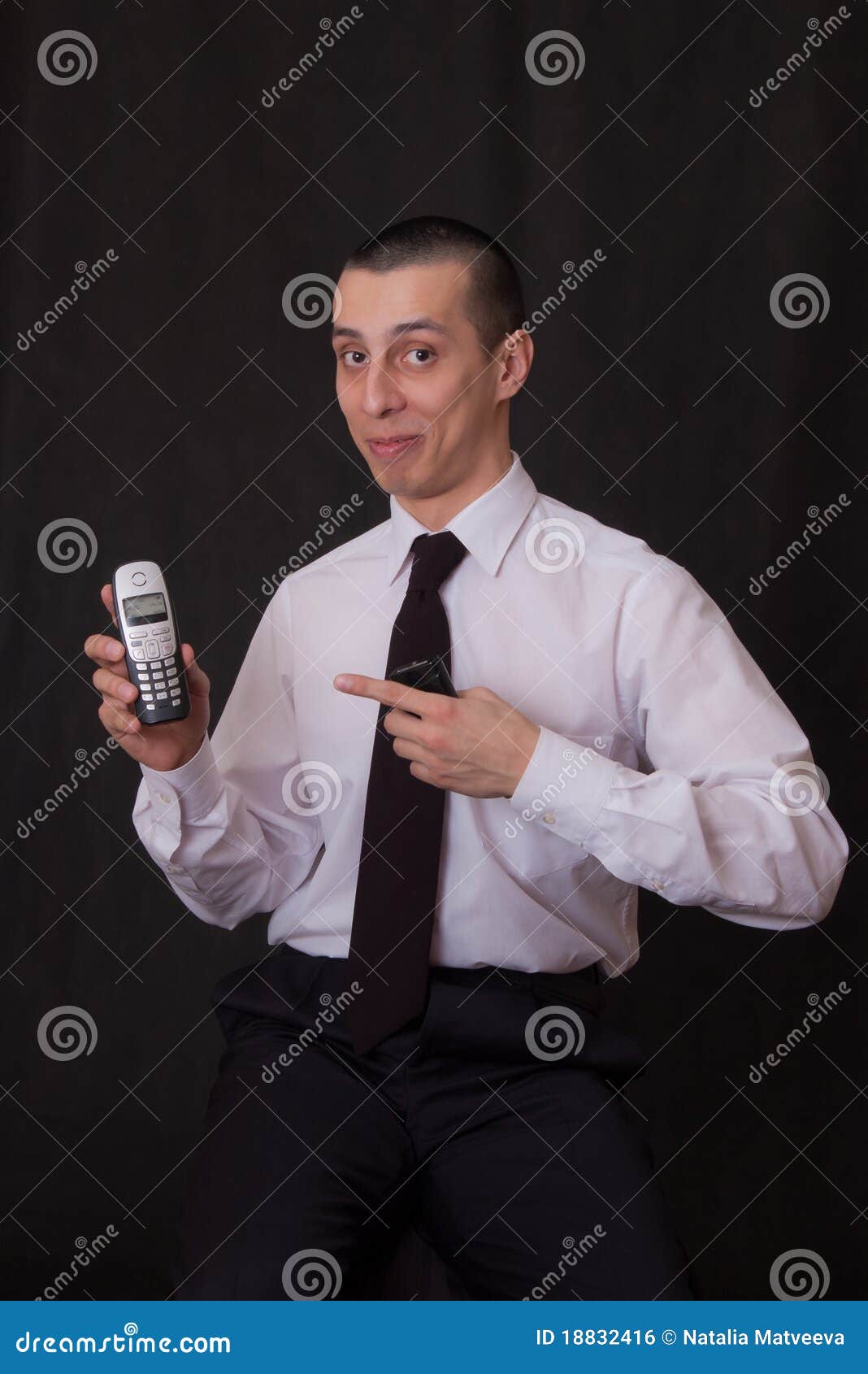 Young Man Pointing on the Phone Stock Photo - Image of happy, laugh ...