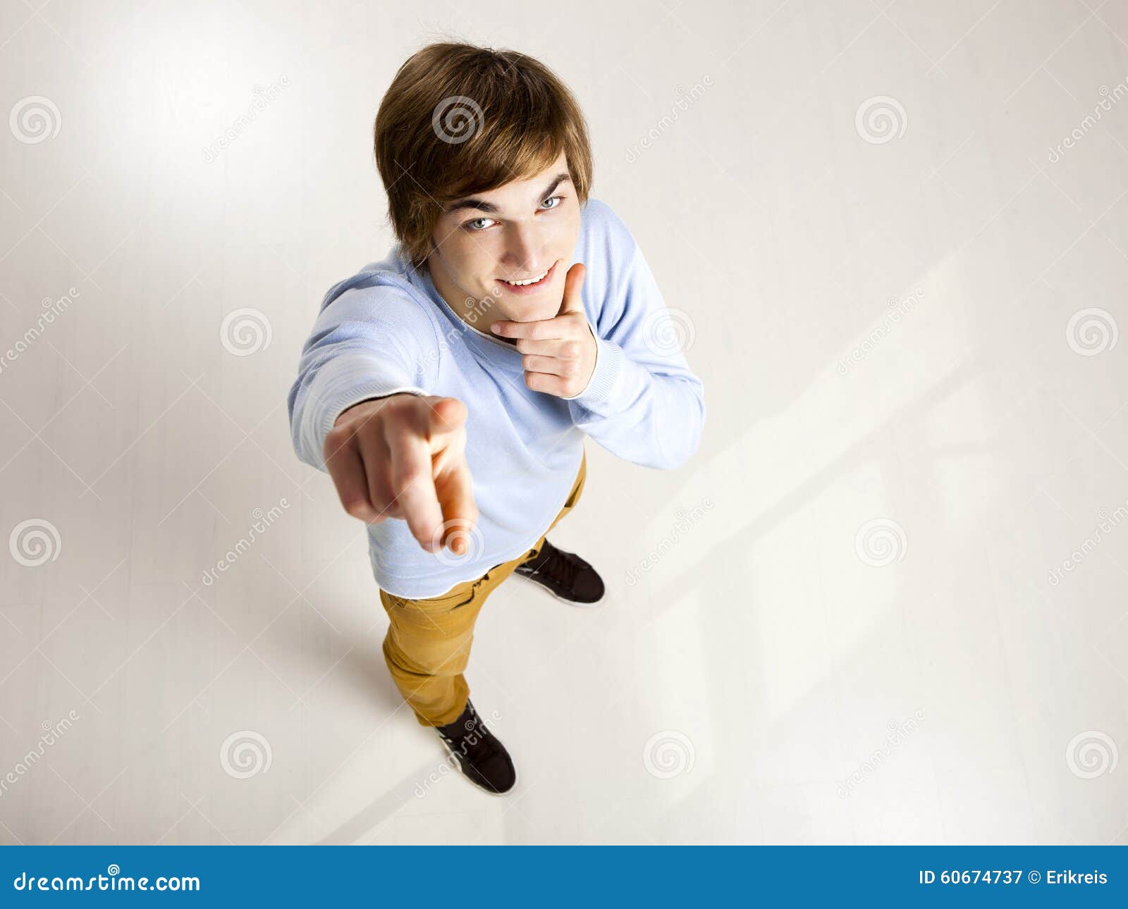 Young man pointing stock image. Image of happy, casual - 60674737