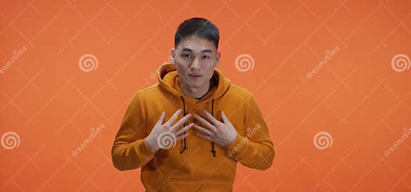 Young Man Politely Avoiding Stock Photo - Image of studio, isolated ...