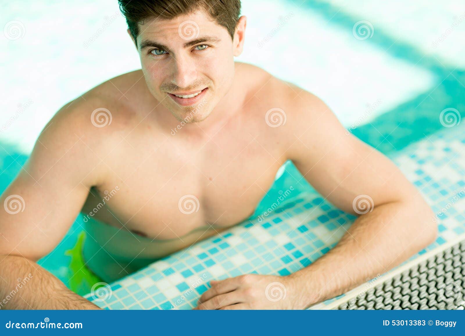 Young man in the pool stock image. Image of strength - 53013383