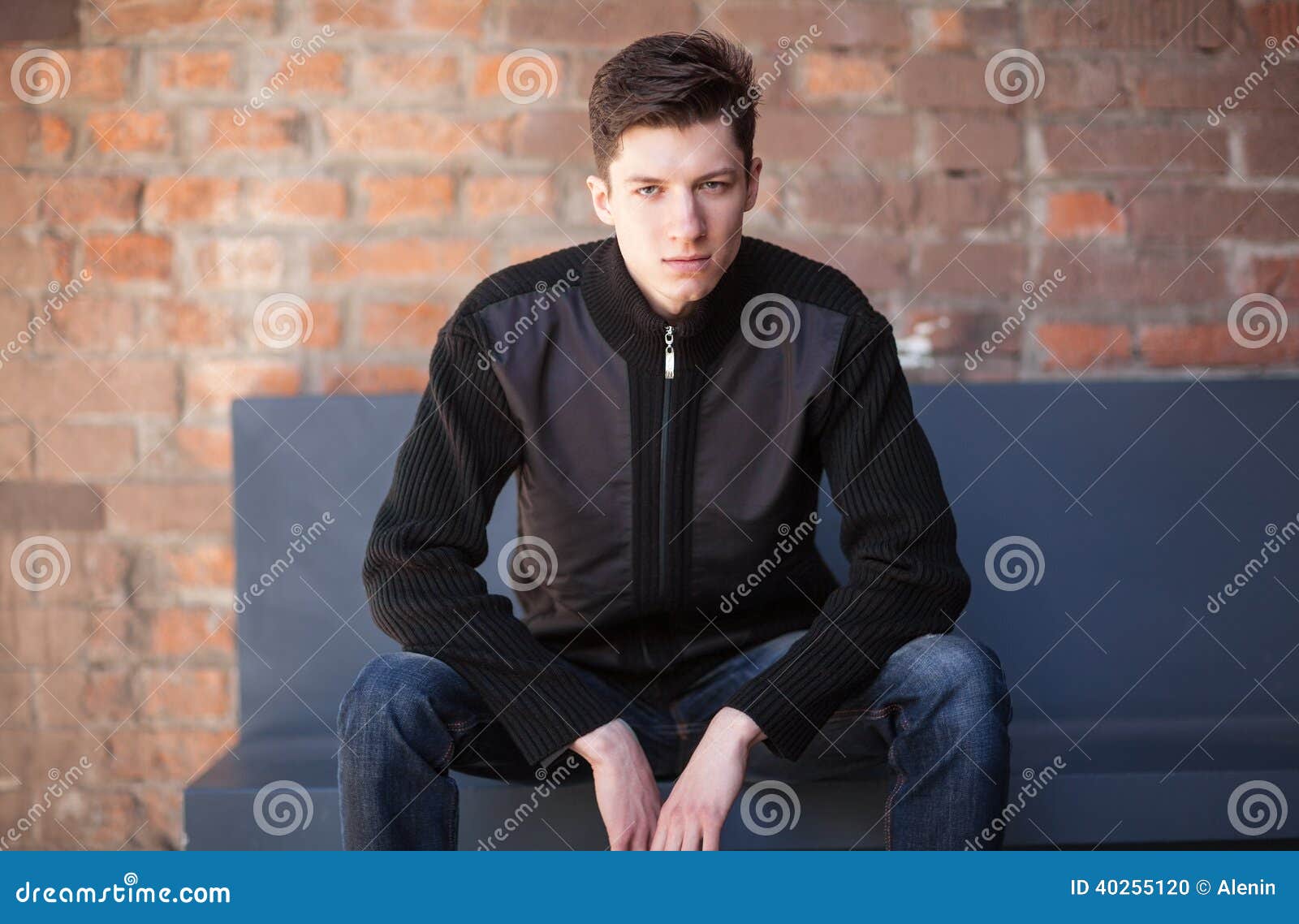 The Young Man Poses Sitting on a Bench Stock Photo - Image of business ...