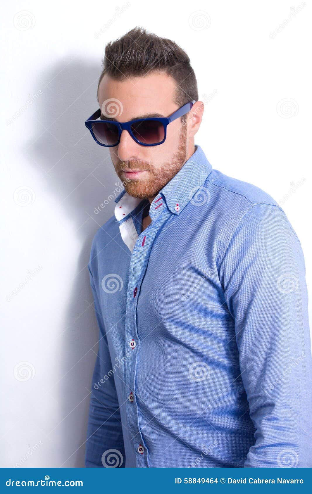 Young Man Posing As a Model. Shadow in the Wall Stock Photo - Image of ...