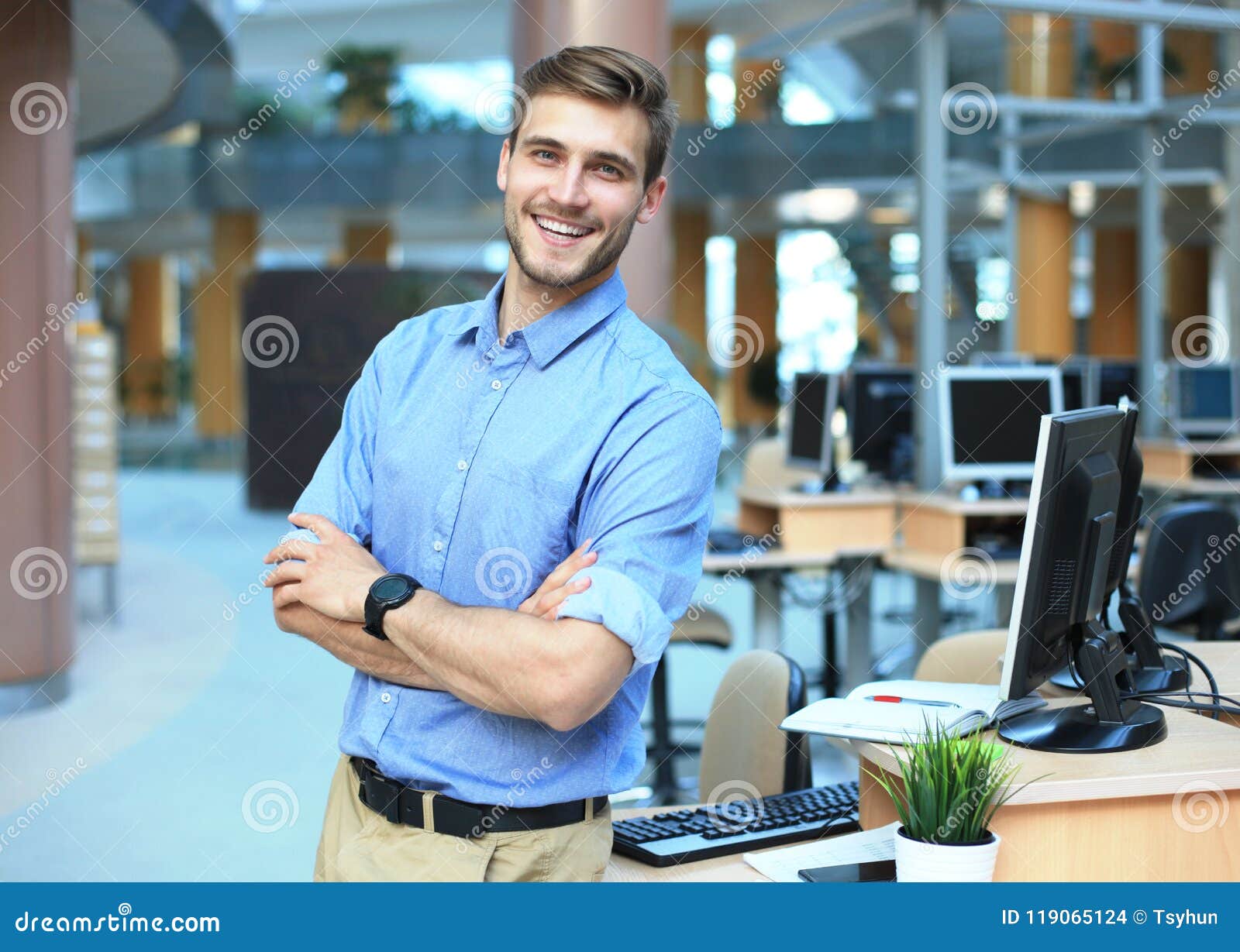 Young Man Posing Confident and Positive in Professional Workplace ...