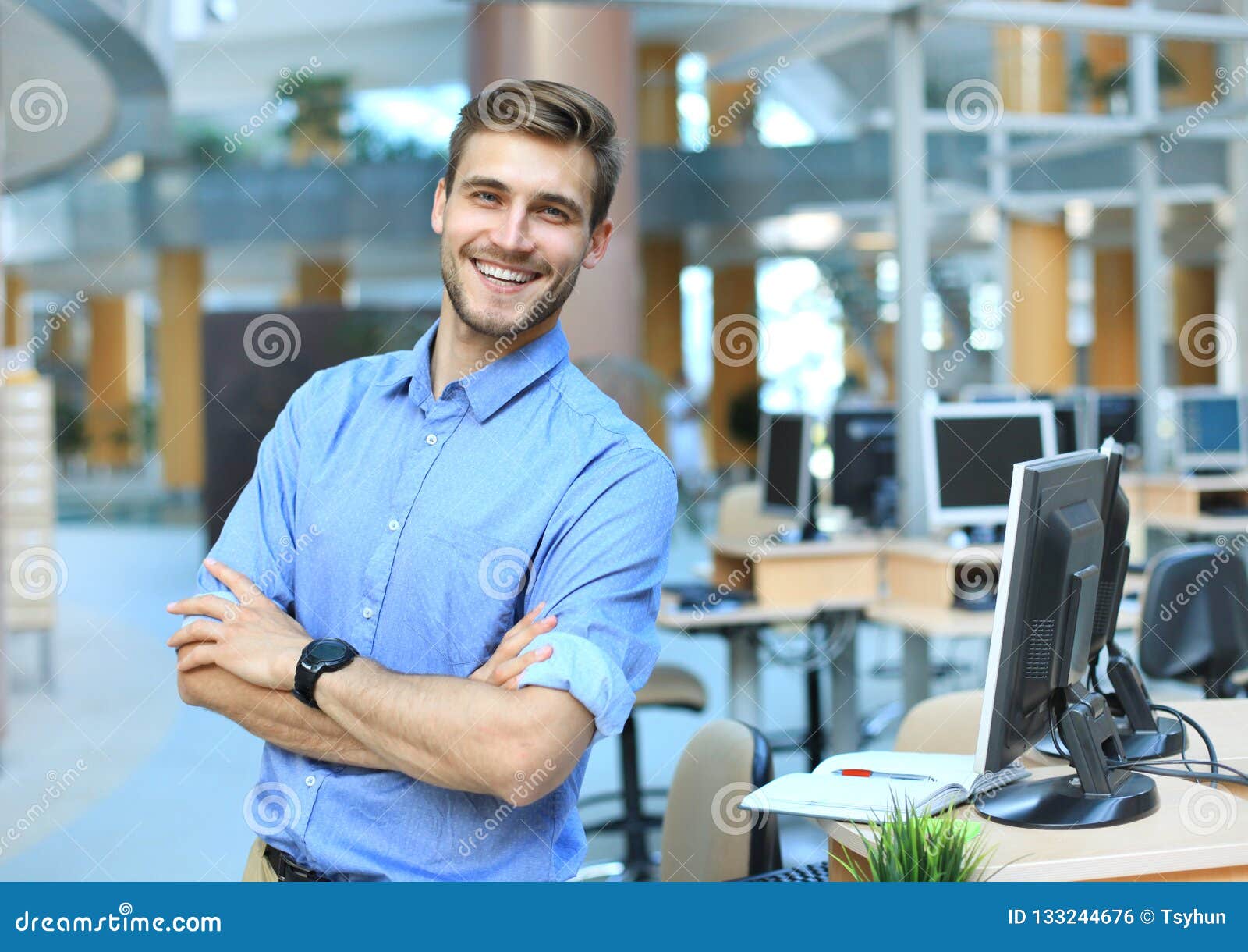 Young Man Posing Confident and Positive in Professional Workplace ...