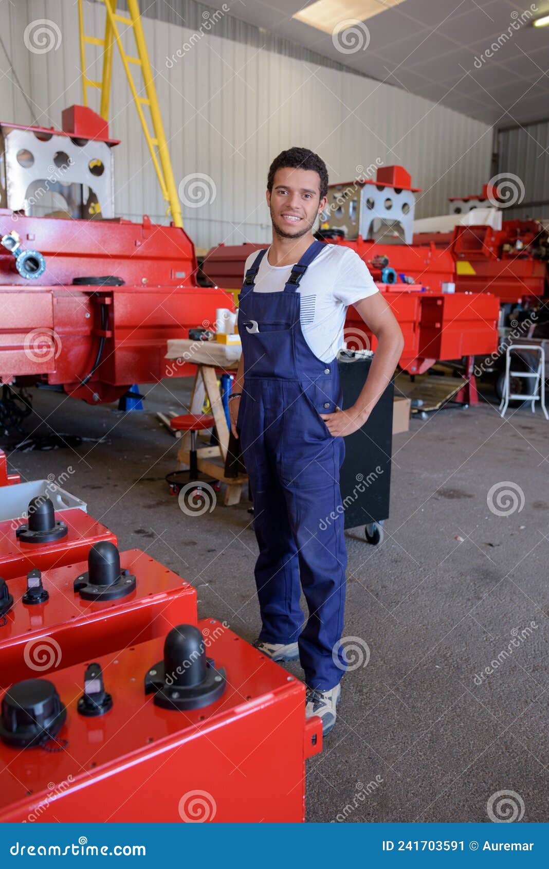 Young Man Posing Next To Red Mechanical Machine Stock Image - Image of ...