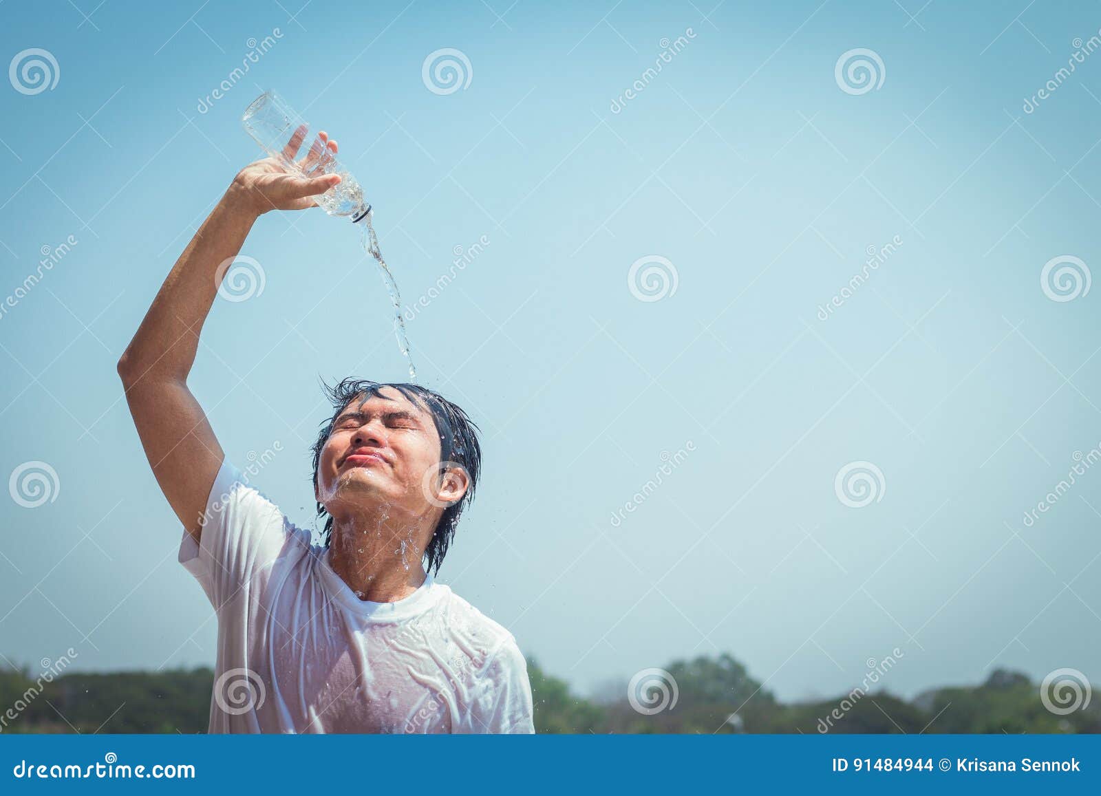 Young man pouring water stock photo. Image of summer - 91484944