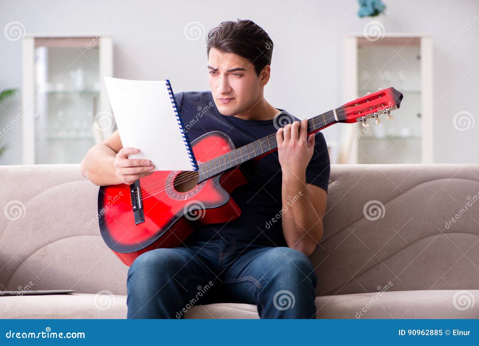 The Young Man Practicing Playing Guitar at Home Stock Image - Image of ...