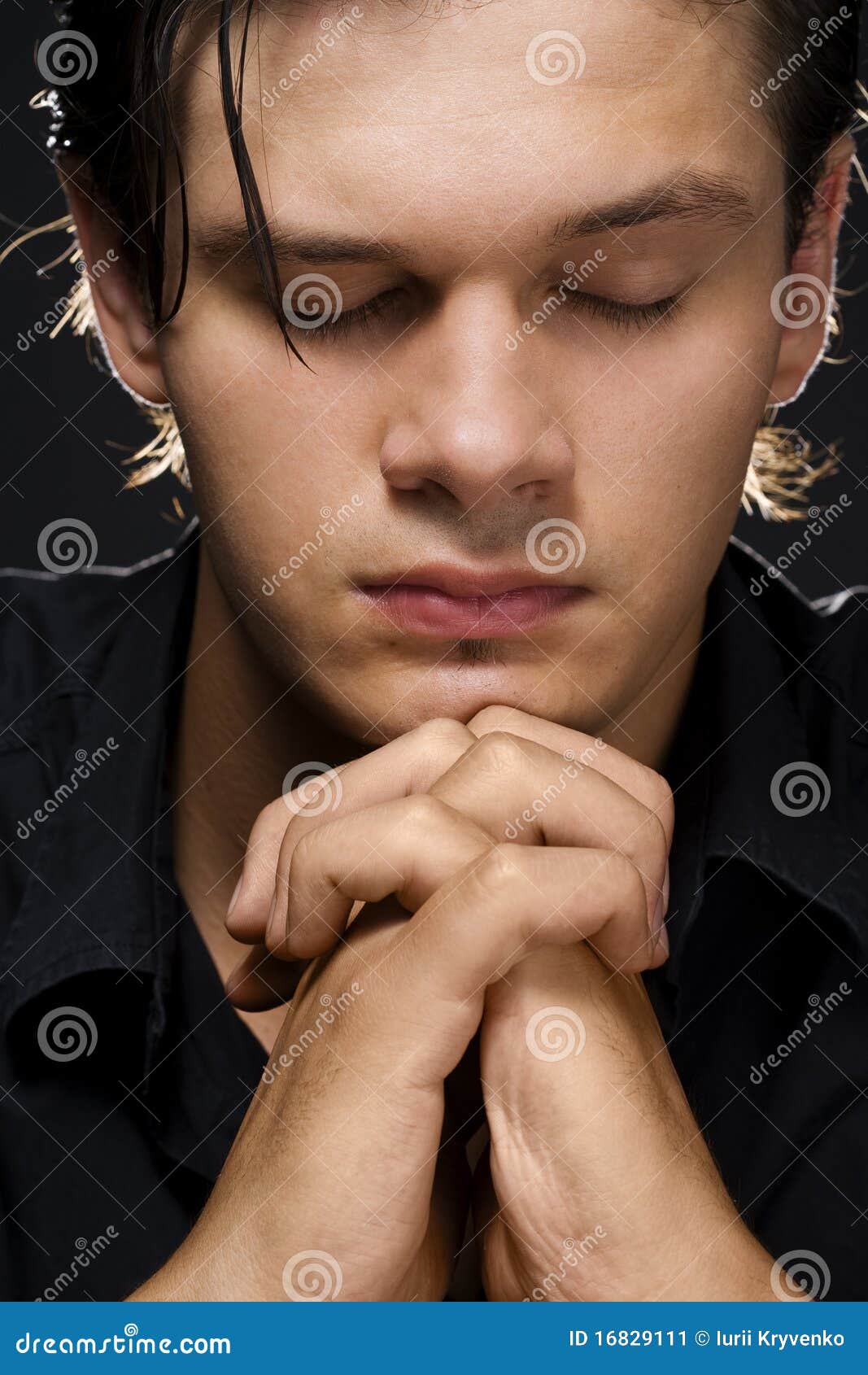 Young man praying stock image. Image of businessman, concept - 16829111