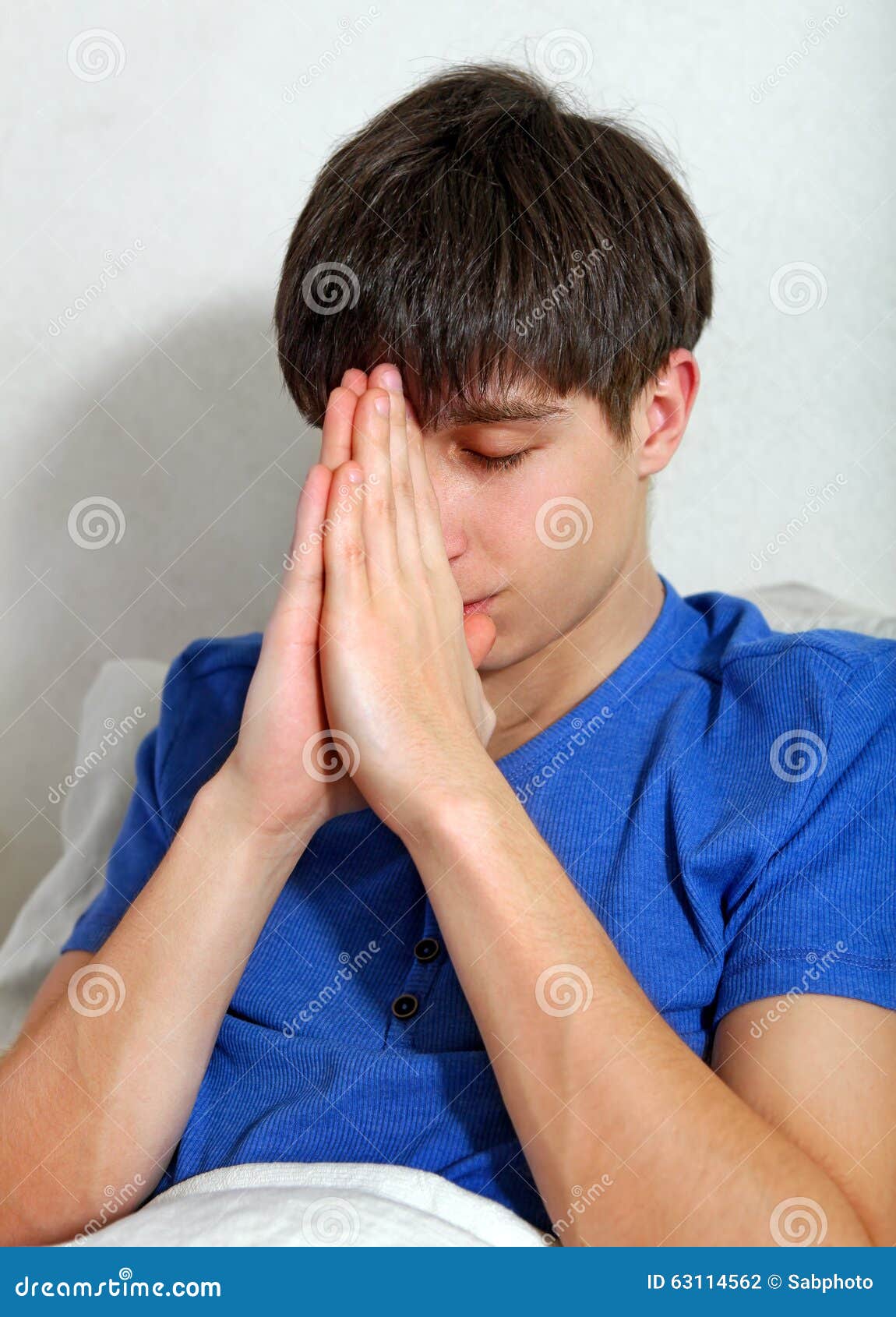 Young Man praying stock photo. Image of gesture, catholicism - 63114562
