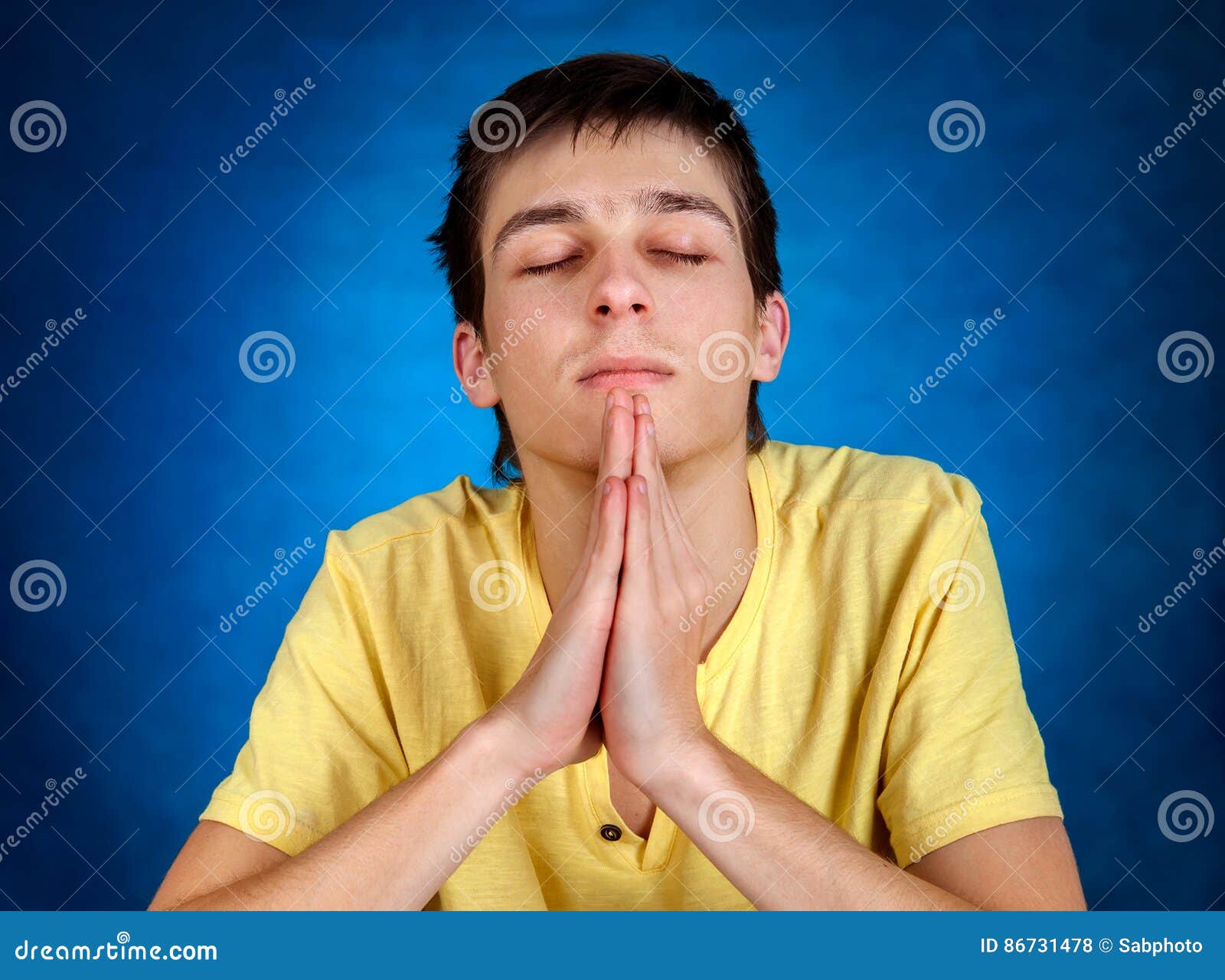 Young Man praying stock photo. Image of meditation, hands - 86731478