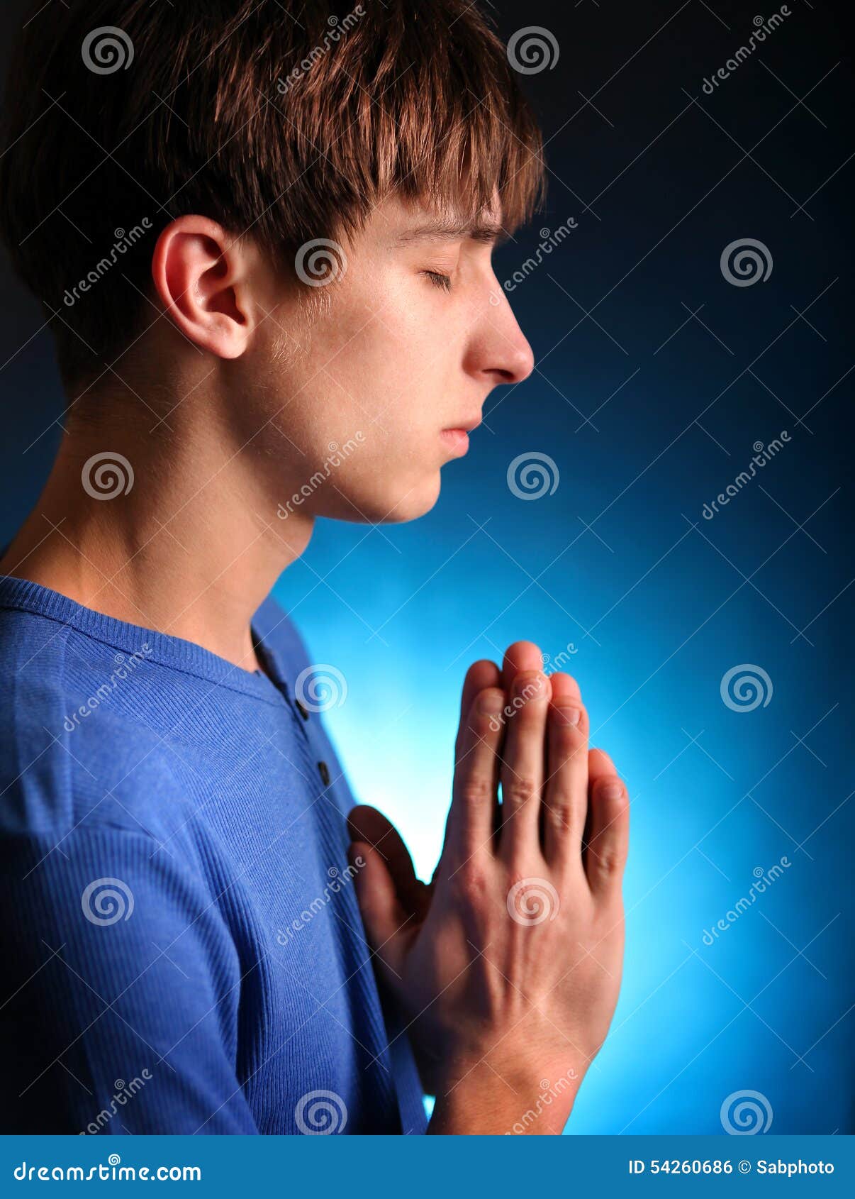 Young Man praying stock photo. Image of prayer, meditation - 54260686