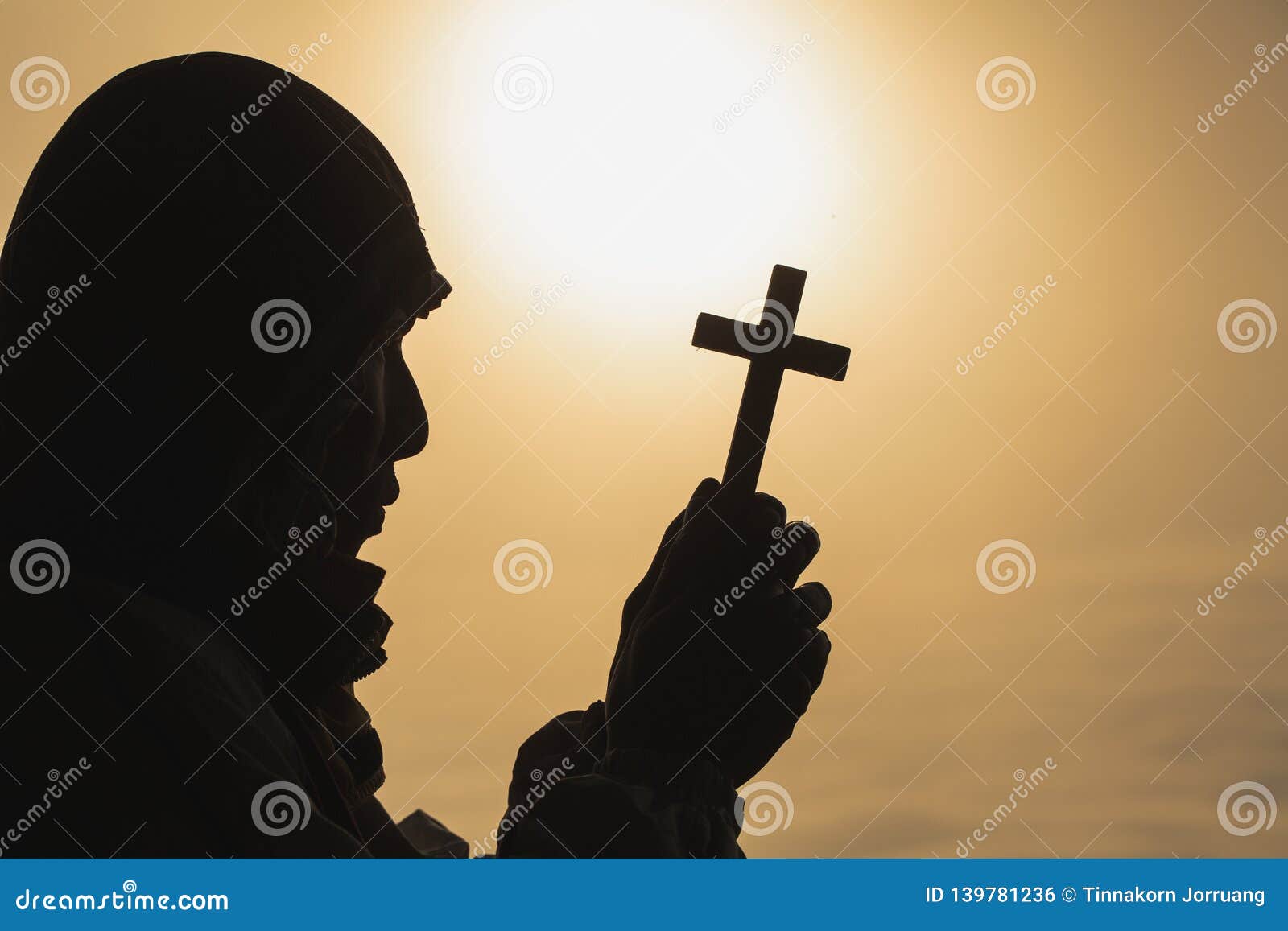 Young Man Praying with the Holy Cross in the Morning Stock Photo ...