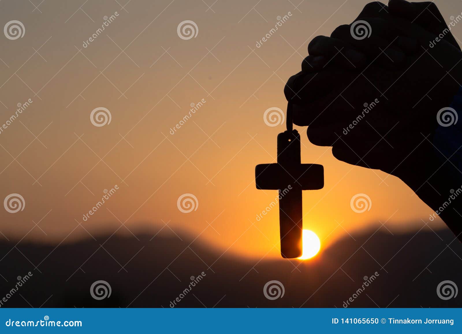 Young Man Praying with the Holy Cross in the Morning Stock Photo ...