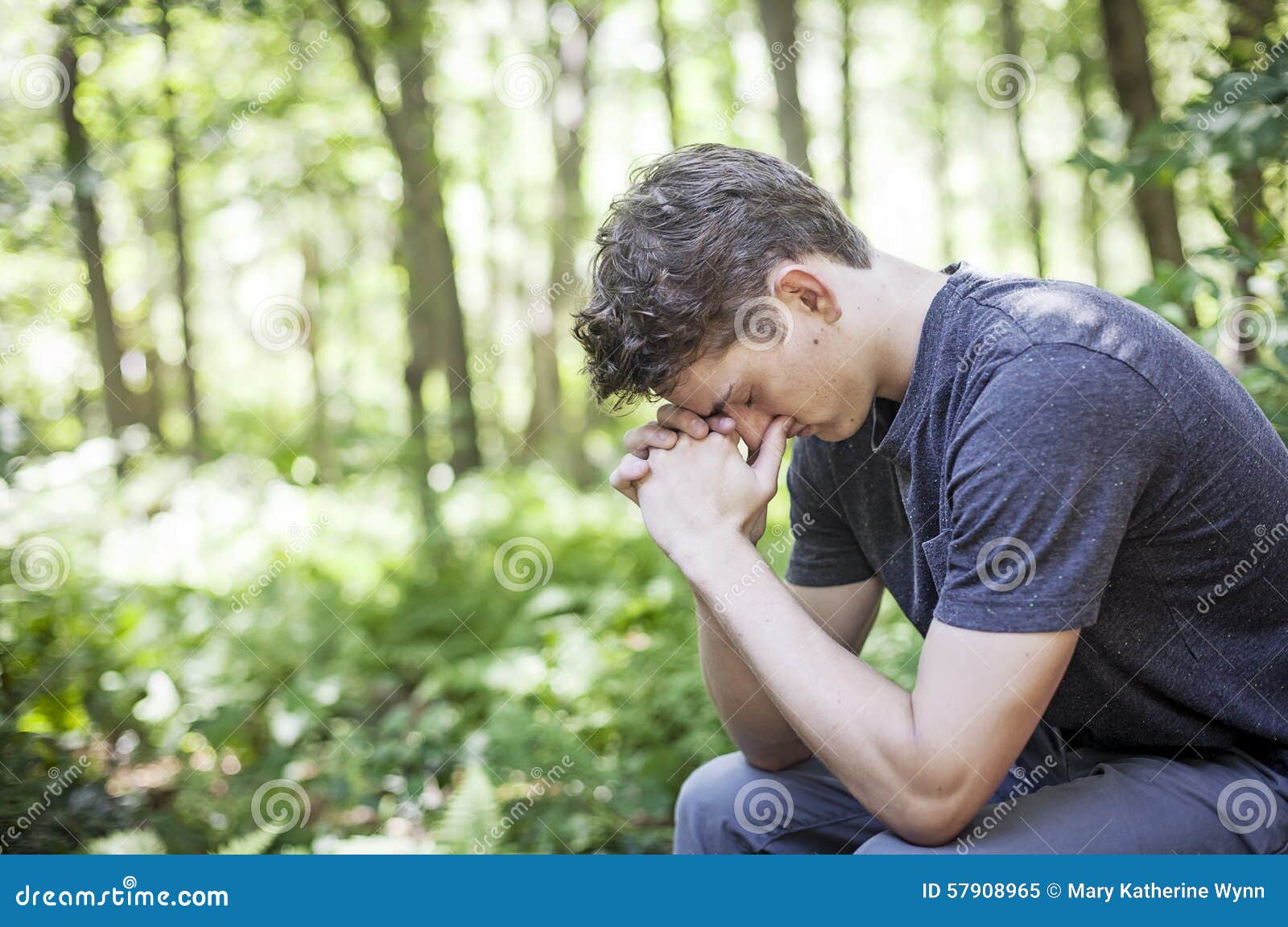 Young man praying stock image. Image of outside, hope - 57908965