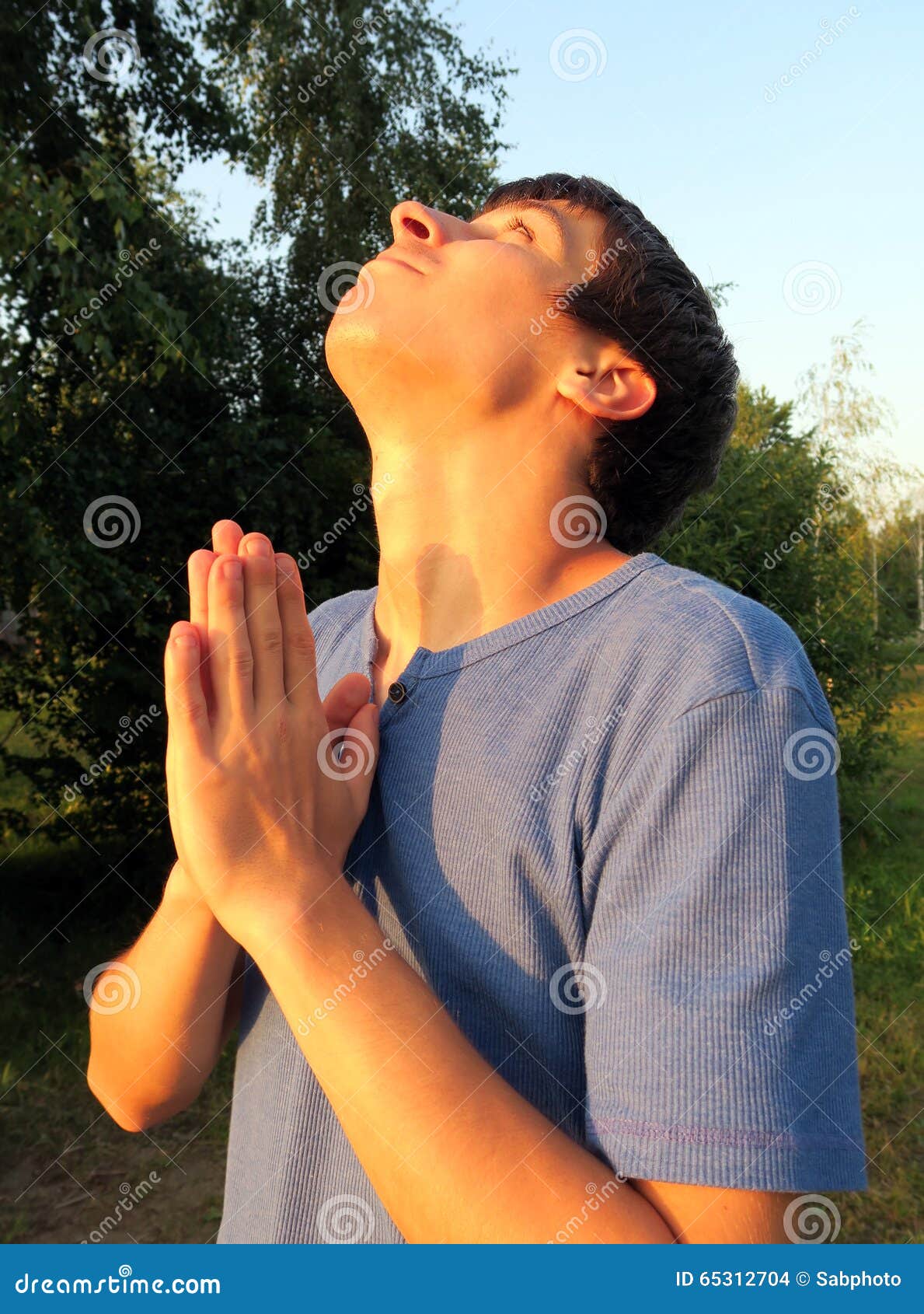 Young Man Praying stock photo. Image of nature, pray - 65312704
