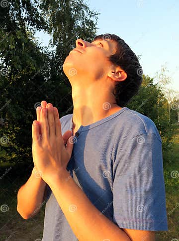 Young Man Praying stock photo. Image of nature, pray - 65312704