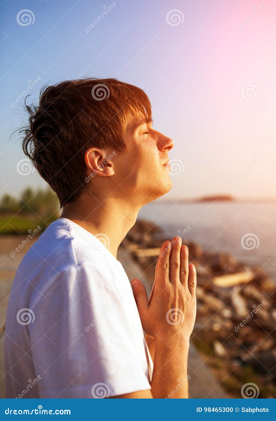Young Man praying stock photo. Image of arms, rural, idyllic - 98465300