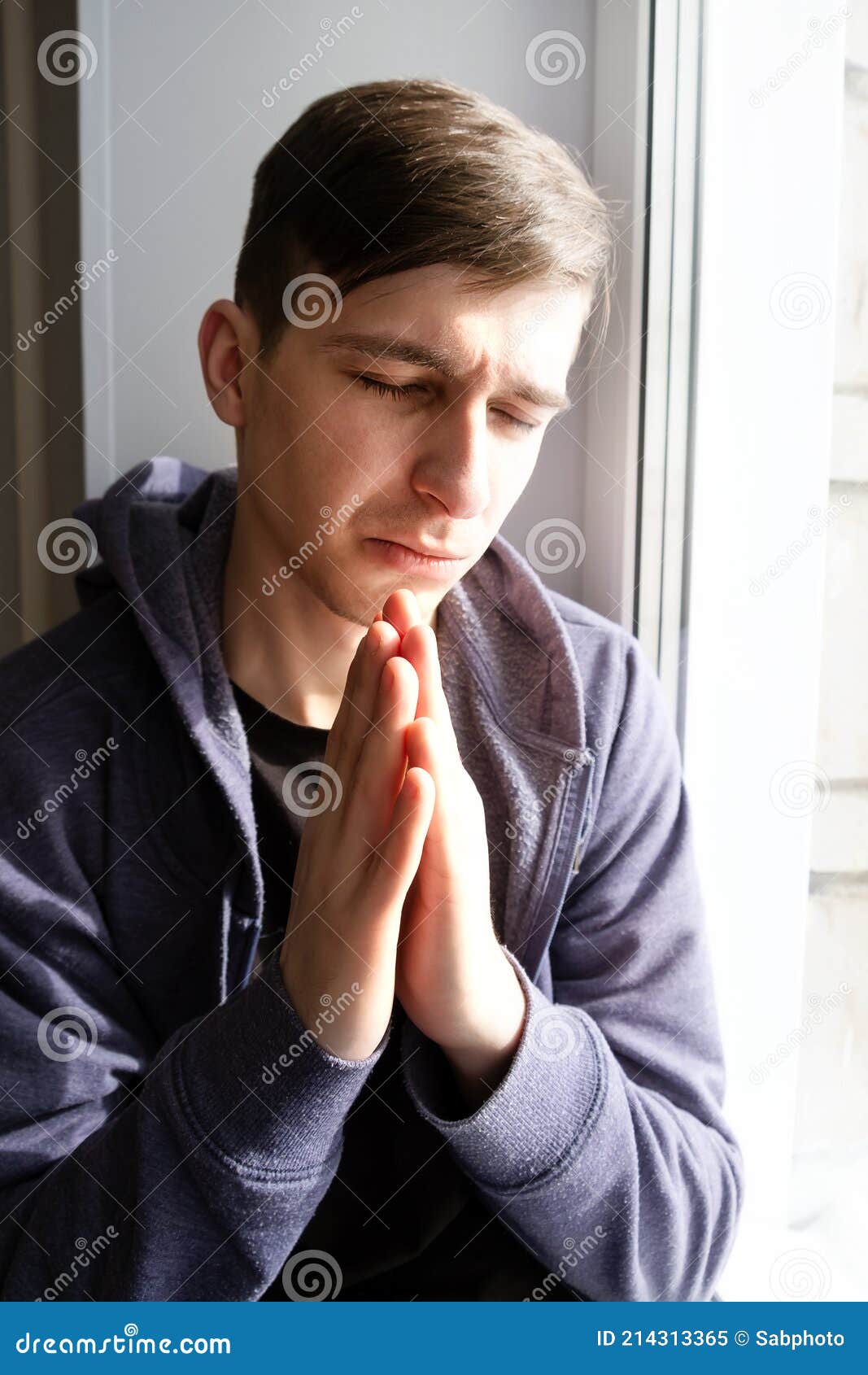 Young Man praying stock image. Image of human, home - 214313365