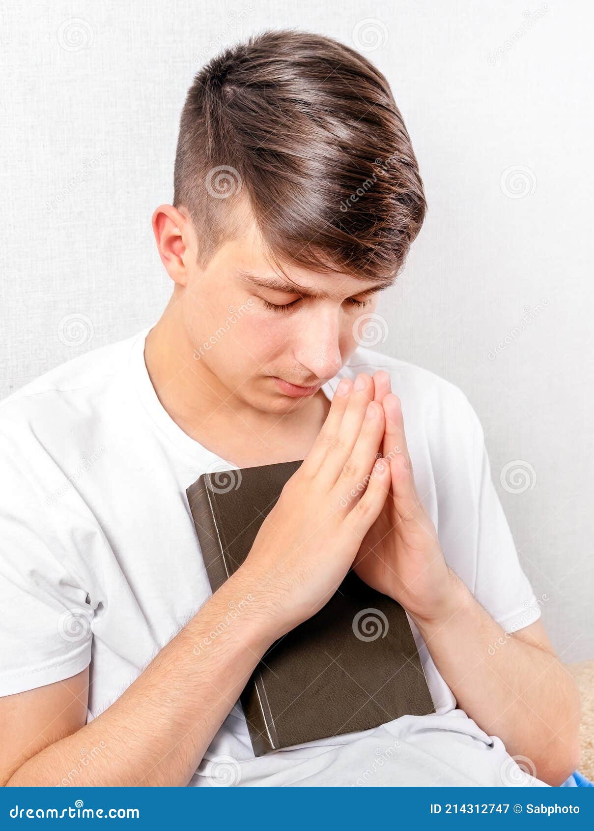 Young Man praying stock image. Image of cute, book, adult - 214312747