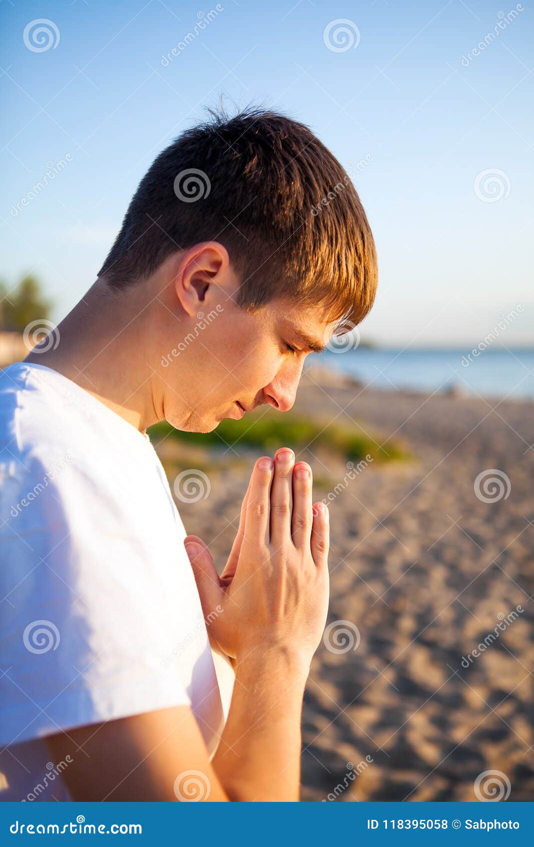 Young Man praying stock photo. Image of cute, gesture - 118395058