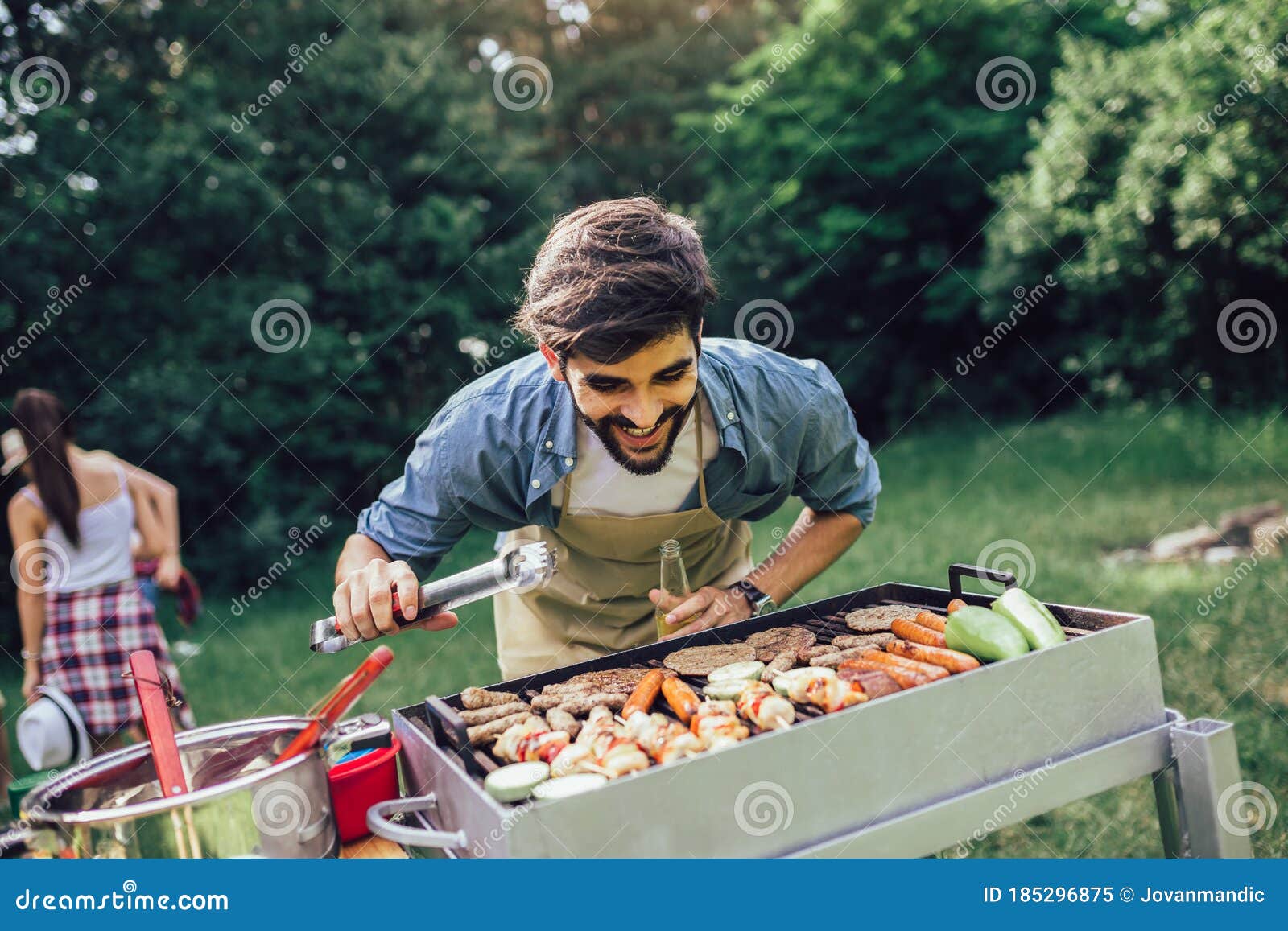Man Preparing Barbecue for Friends Outdoor Stock Image - Image of meat ...
