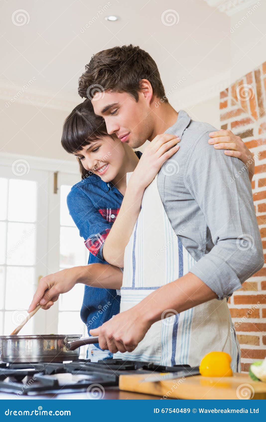 Young man preparing a meal stock image. Image of happy - 67540489