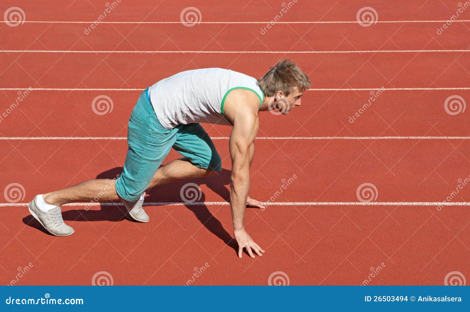 Young man preparing to run stock photo. Image of action - 26503494