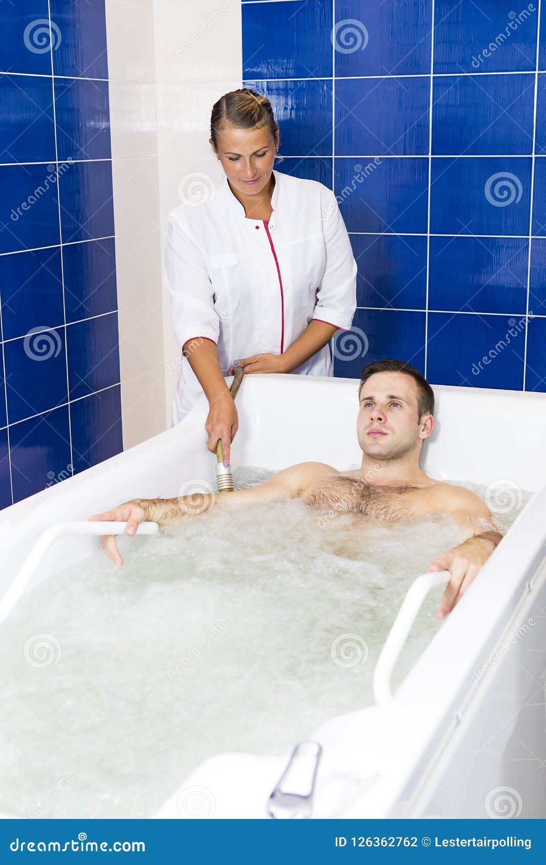 Young Man is the Procedure in the Whirlpool Hydrobath Stock Photo ...