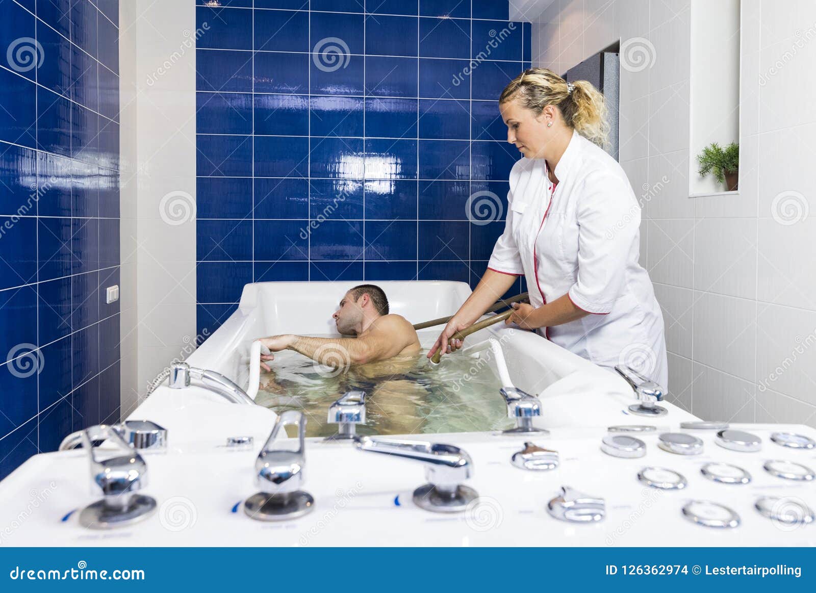 Young Man is the Procedure in the Whirlpool Hydrobath Stock Photo ...