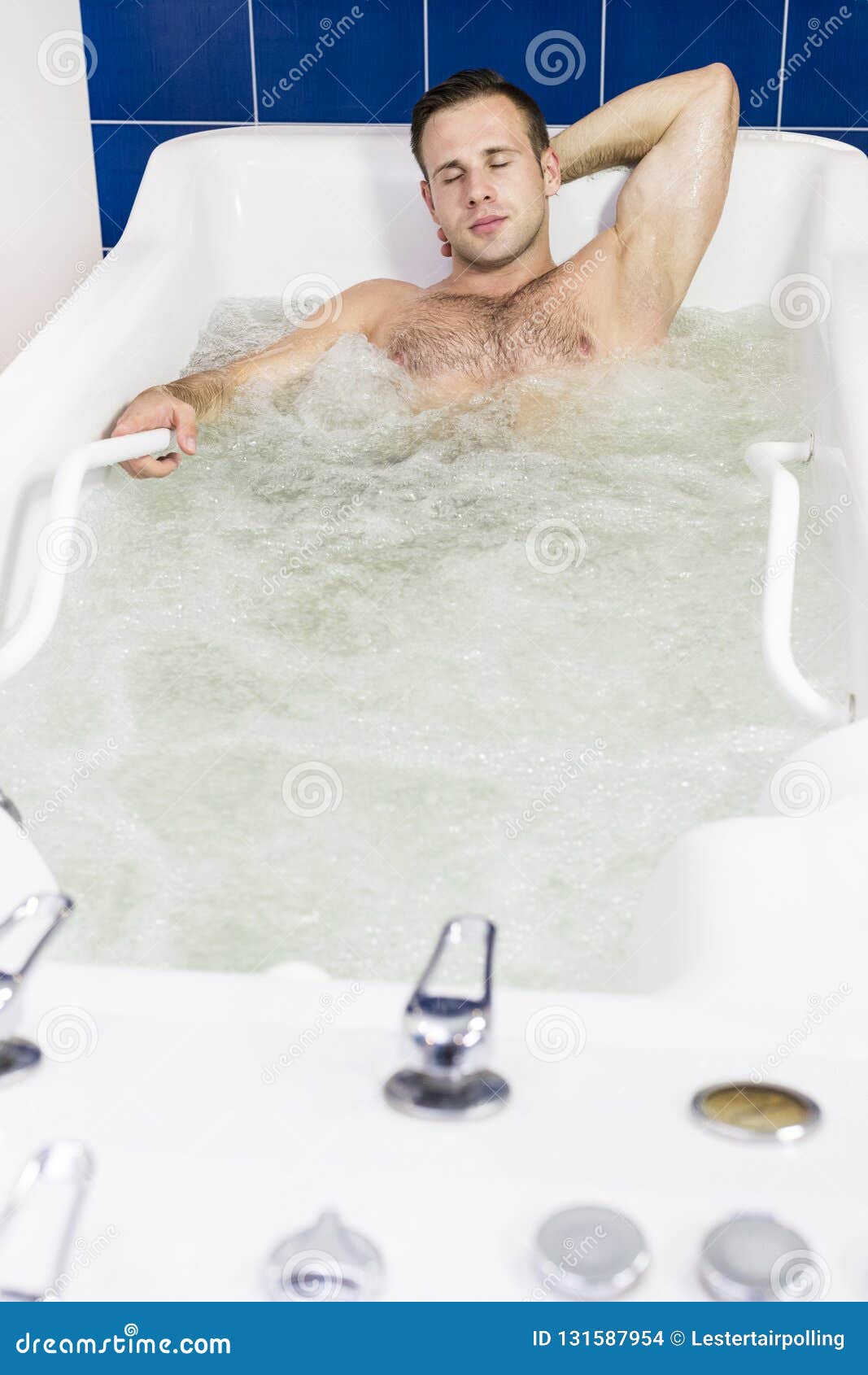 Young Man is the Procedure in the Whirlpool Hydrobath Stock Photo ...