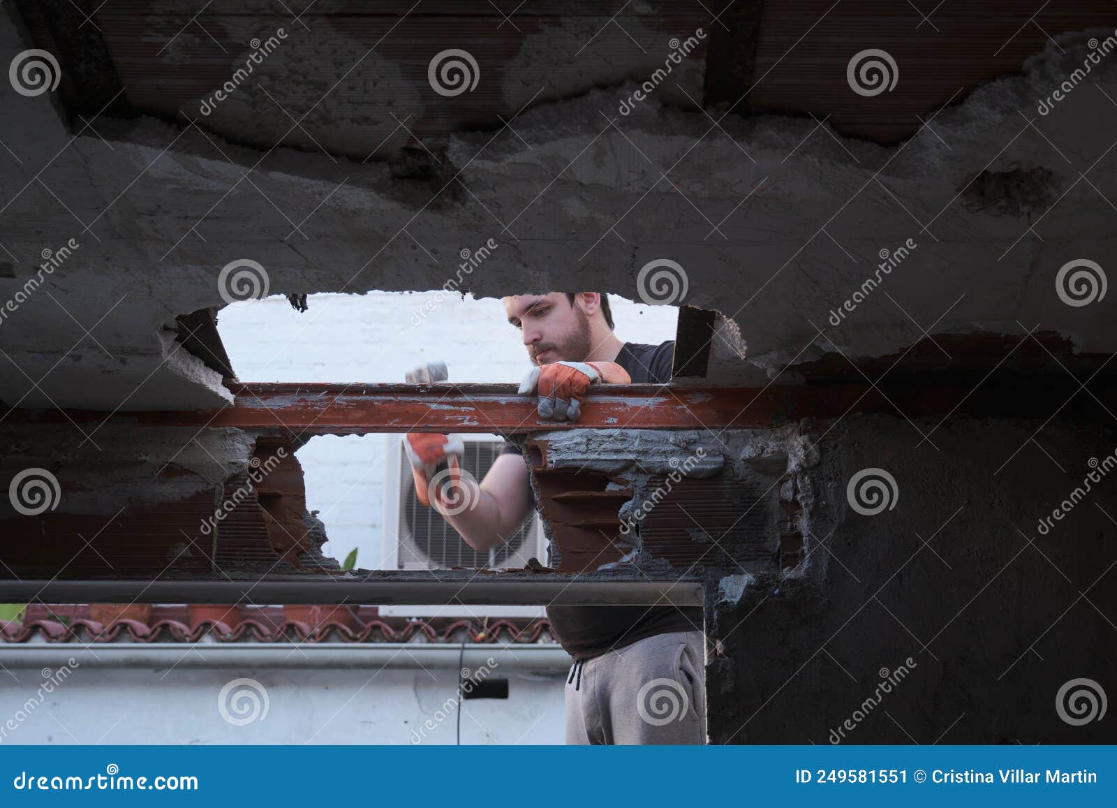 Young Man Pulling the Ceiling of a House Down. Stock Image - Image of ...