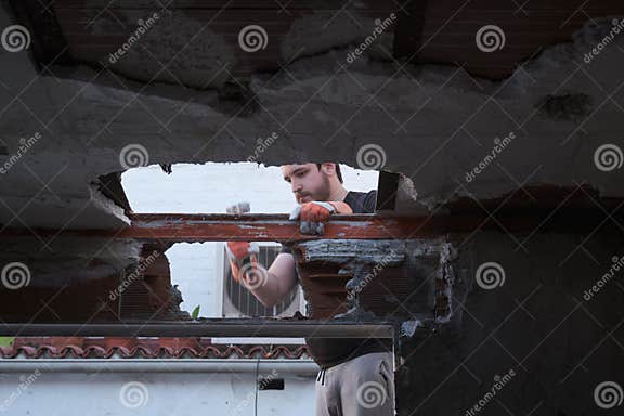 Young Man Pulling the Ceiling of a House Down. Stock Image - Image of ...