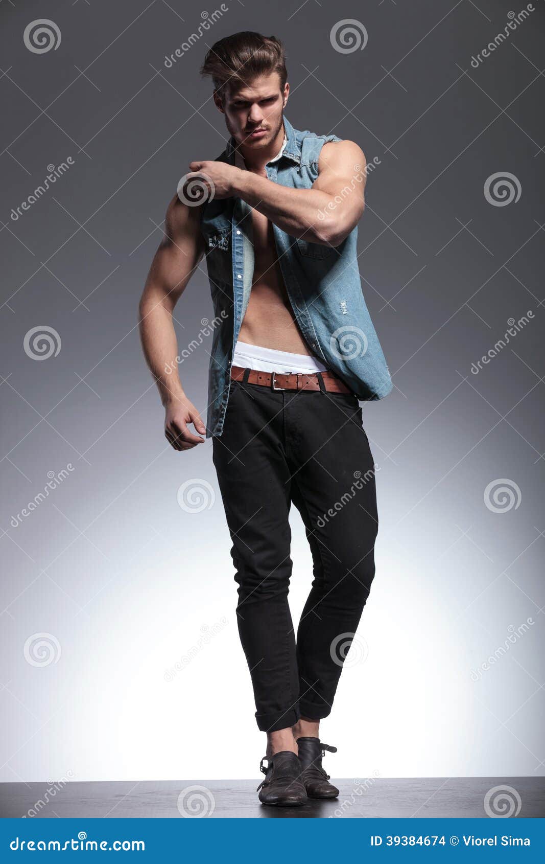 Young Man Pulls Up His Sleeve Stock Photo - Image of defined, healthy ...