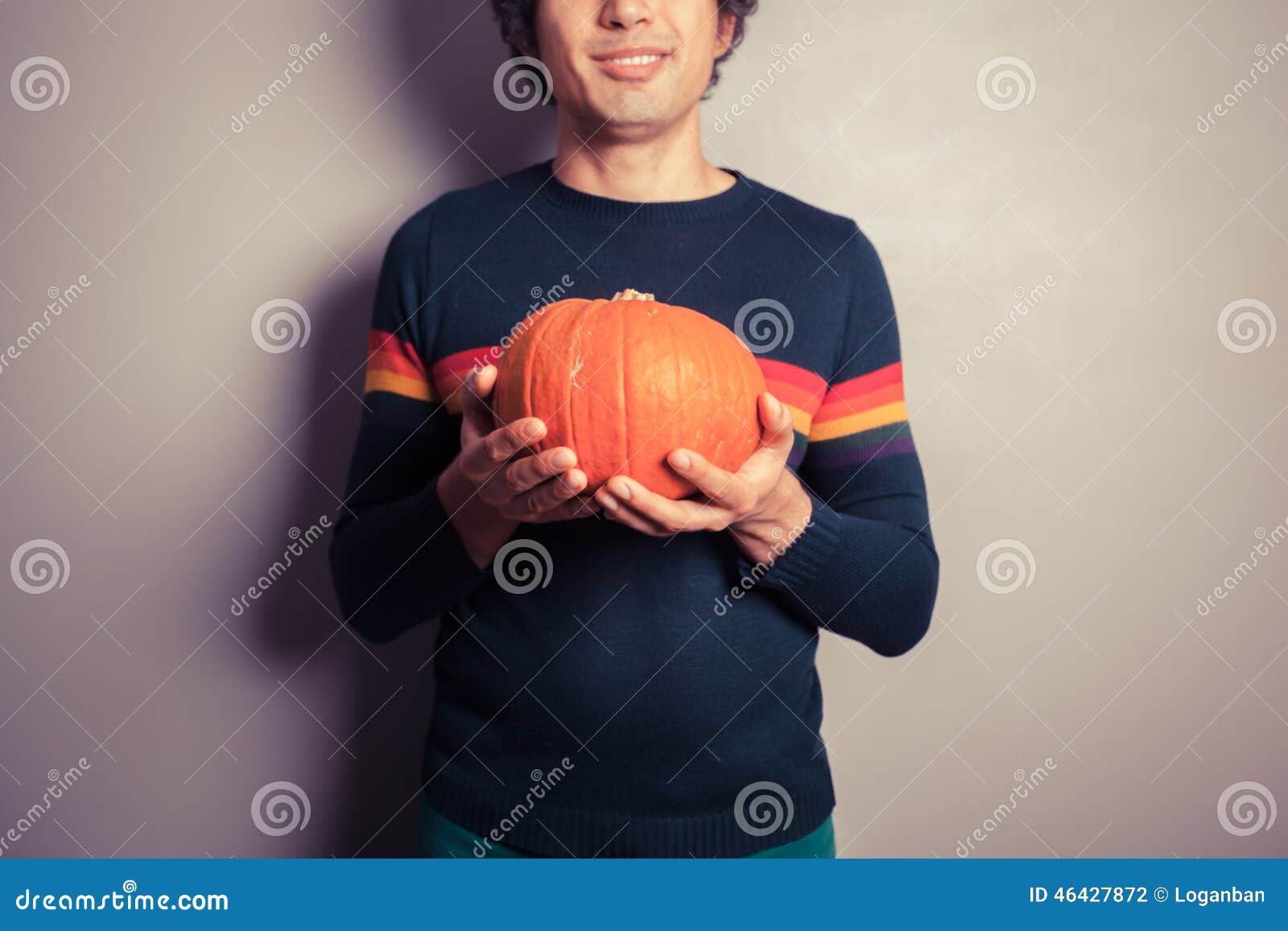 Young man with pumpkin stock photo. Image of festive - 46427872