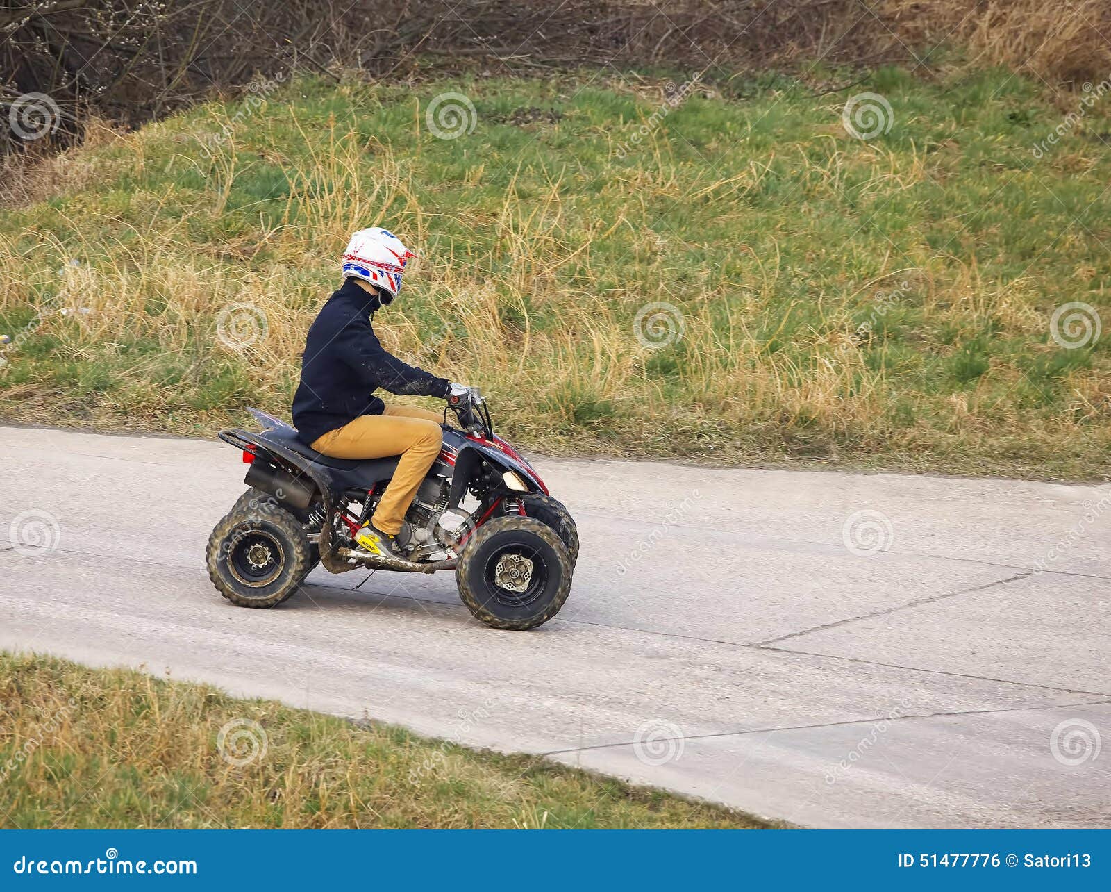 Young man on a quad stock photo. Image of helmet, dirt - 51477776