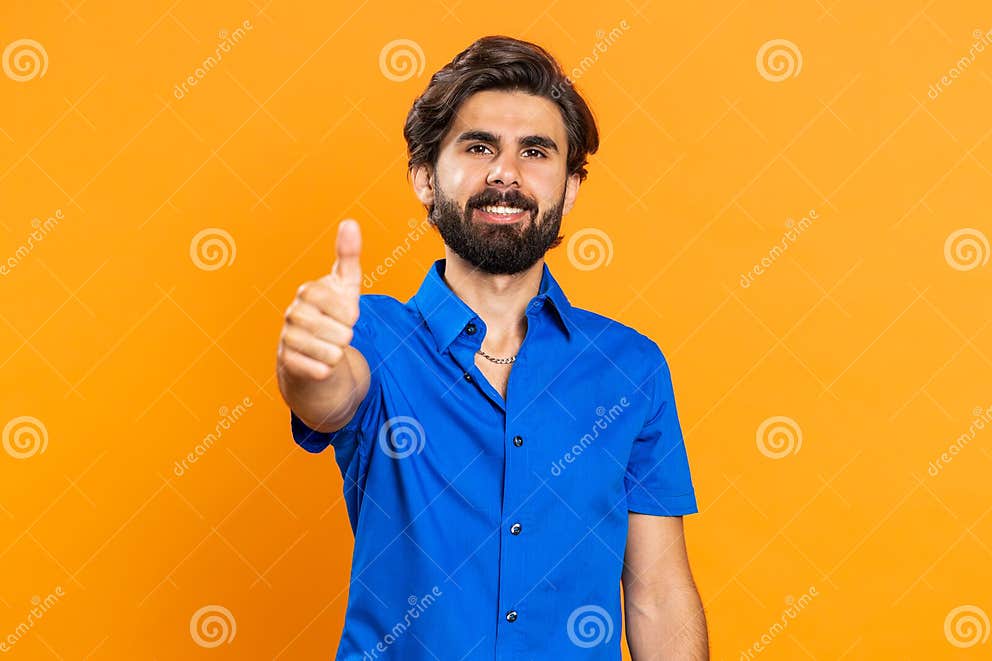 Young Man Raises Thumbs Up Agrees Or Gives Positive Reply Recommends