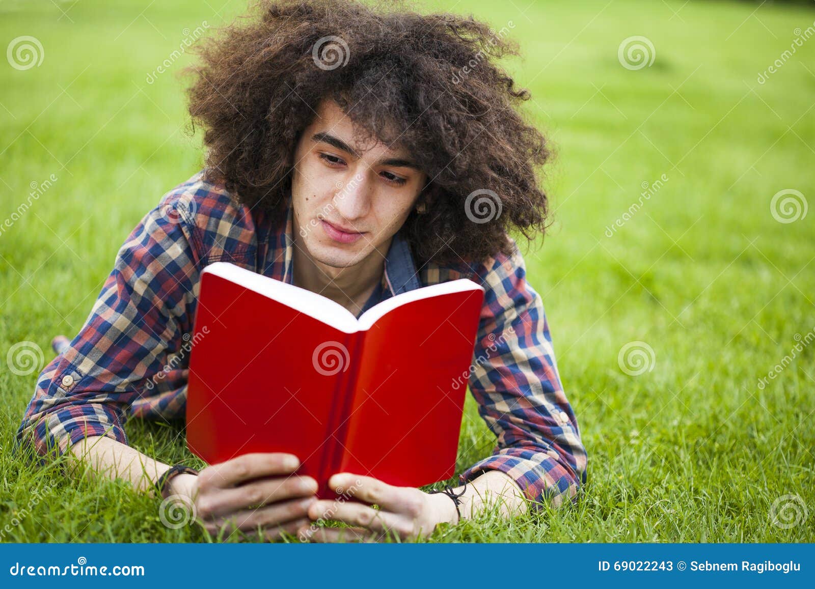 Young Man Read Book in Grass Stock Image - Image of green, outdoors ...