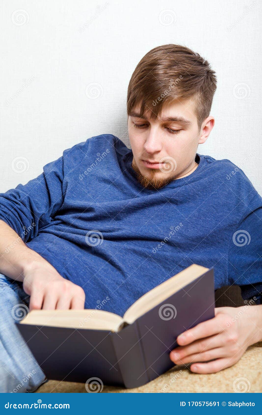 Young Man read a Book stock image. Image of indoor, caucasian - 170575691